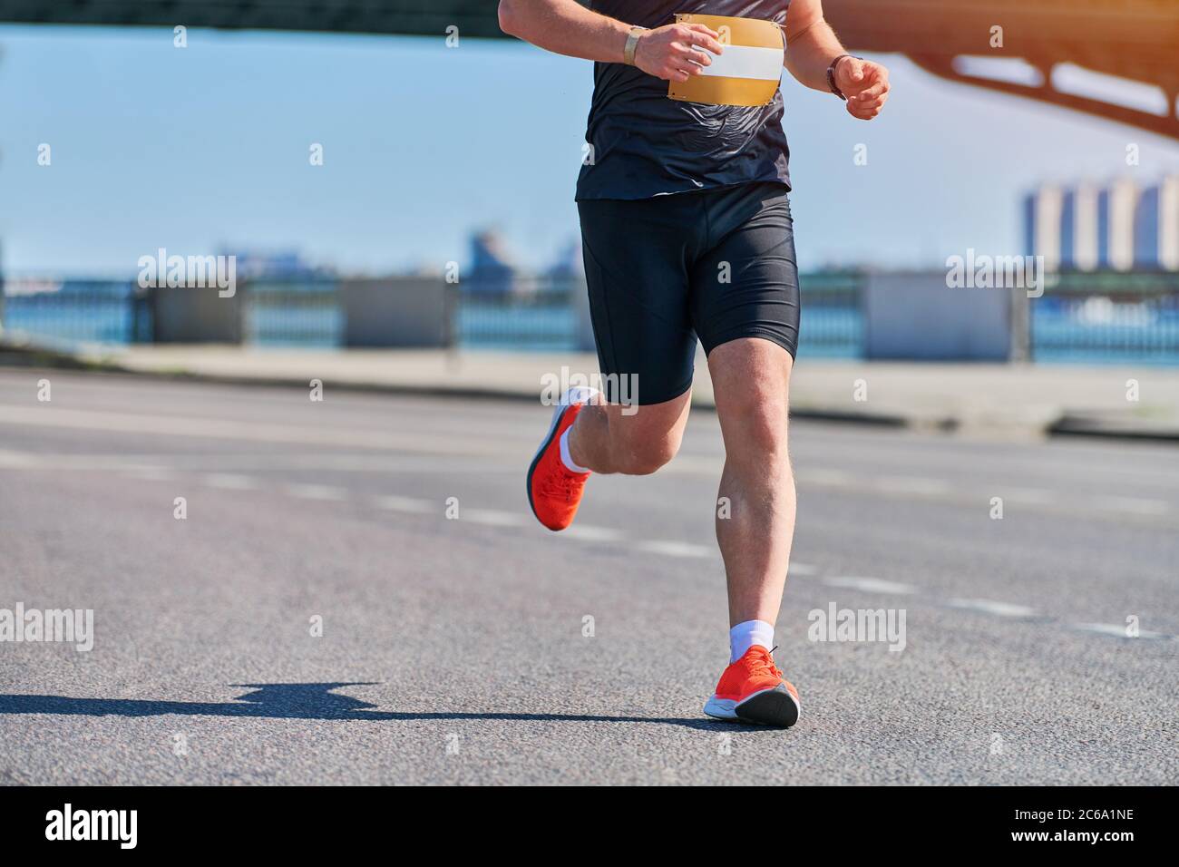 Running man. Athletic man jogging in sportswear on city road. Healthy lifestyle, fitness sport ...