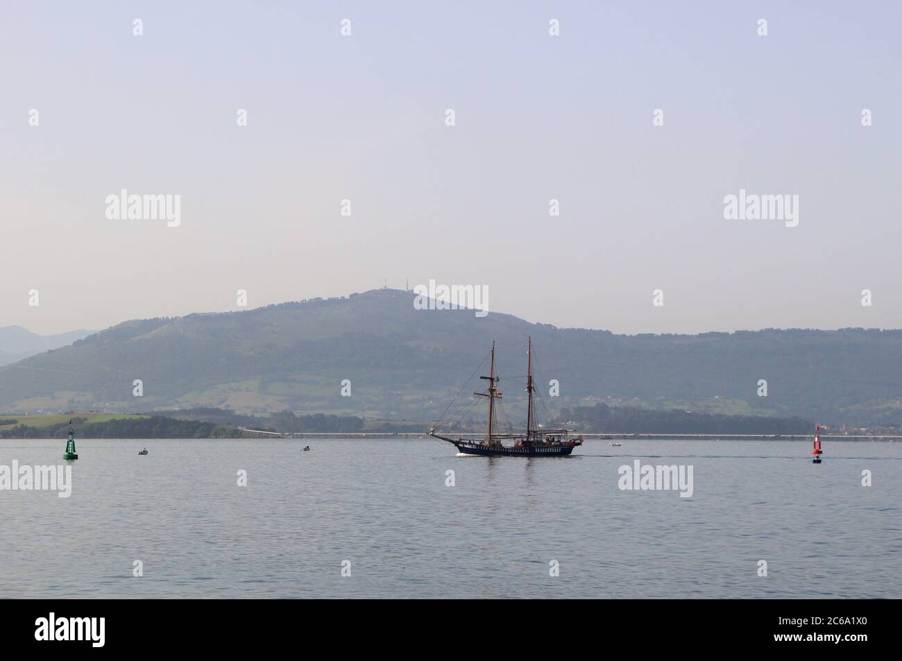 The tall ship Atyla training ship heading out to sea from the bay in ...