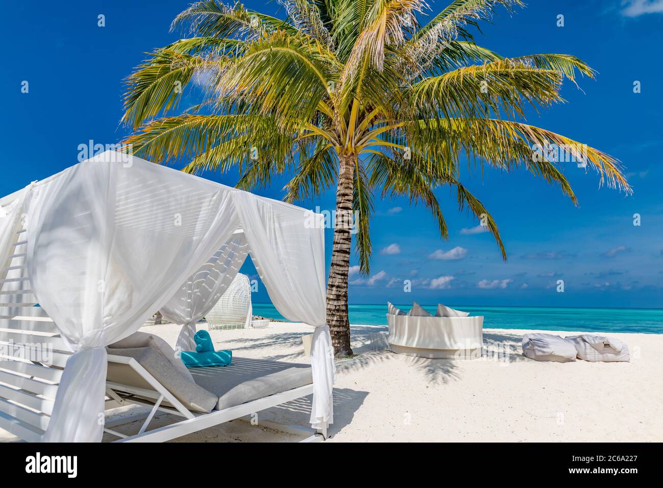 Luxury travel, summer holiday. Comfortable lounge canopy on VIP beach ...