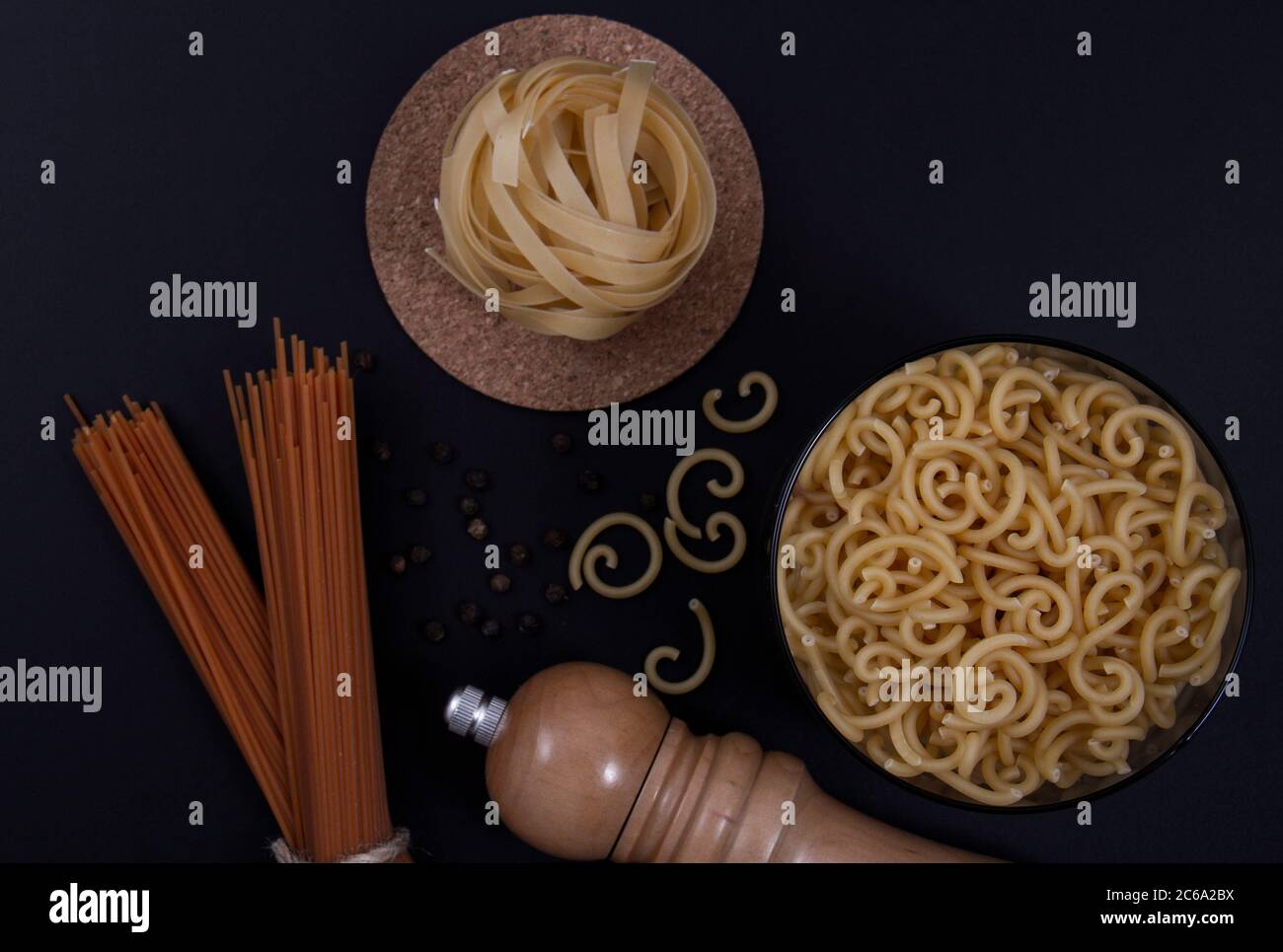 Shaped pasta and plain pasta. Pasta in different shapes and colors with ...