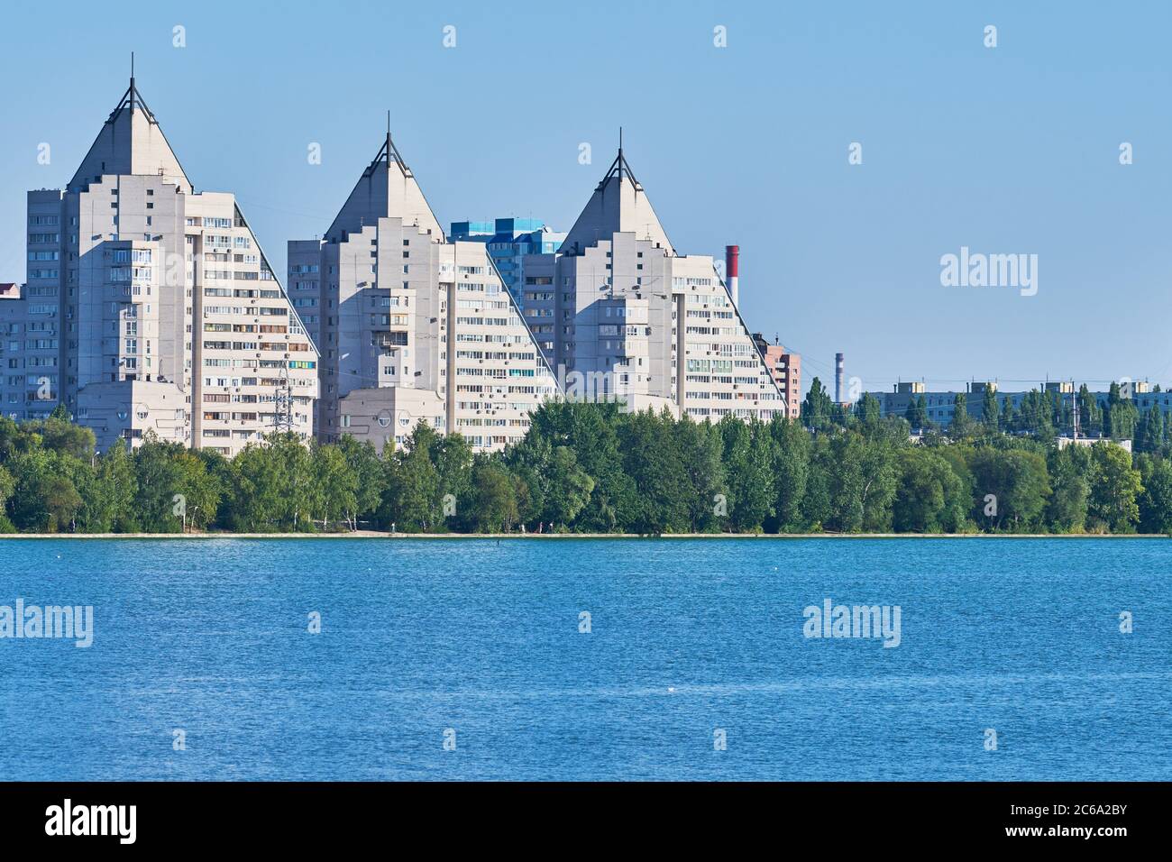 Multistorey pyramid houses view over river. Multi-storey high rise ...