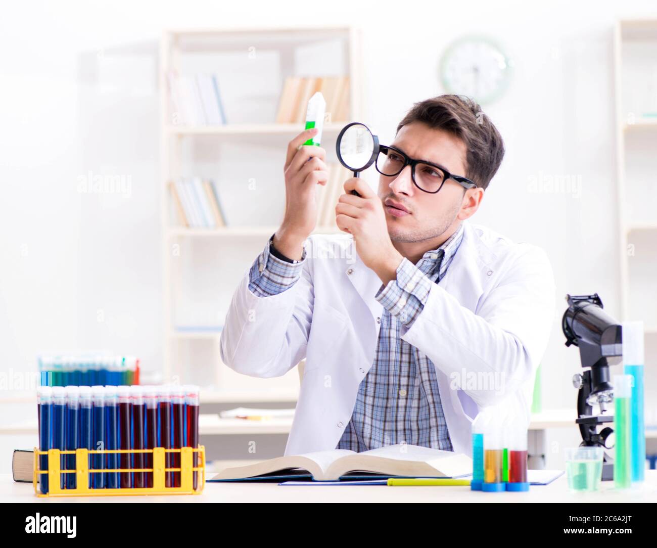 Chemistry student doing chemical experiments at classroom activity ...