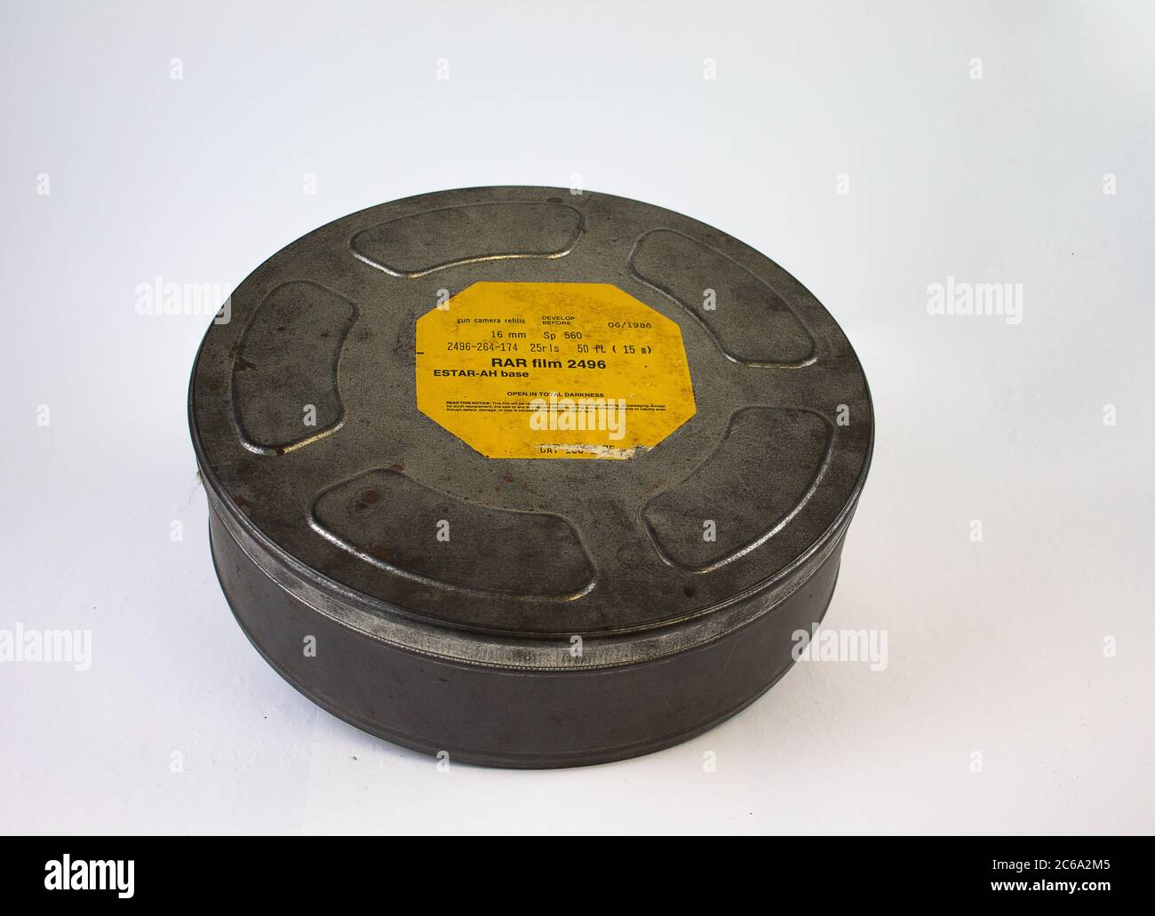 An original old film can with an orange label. For 16 mm film rolls ...