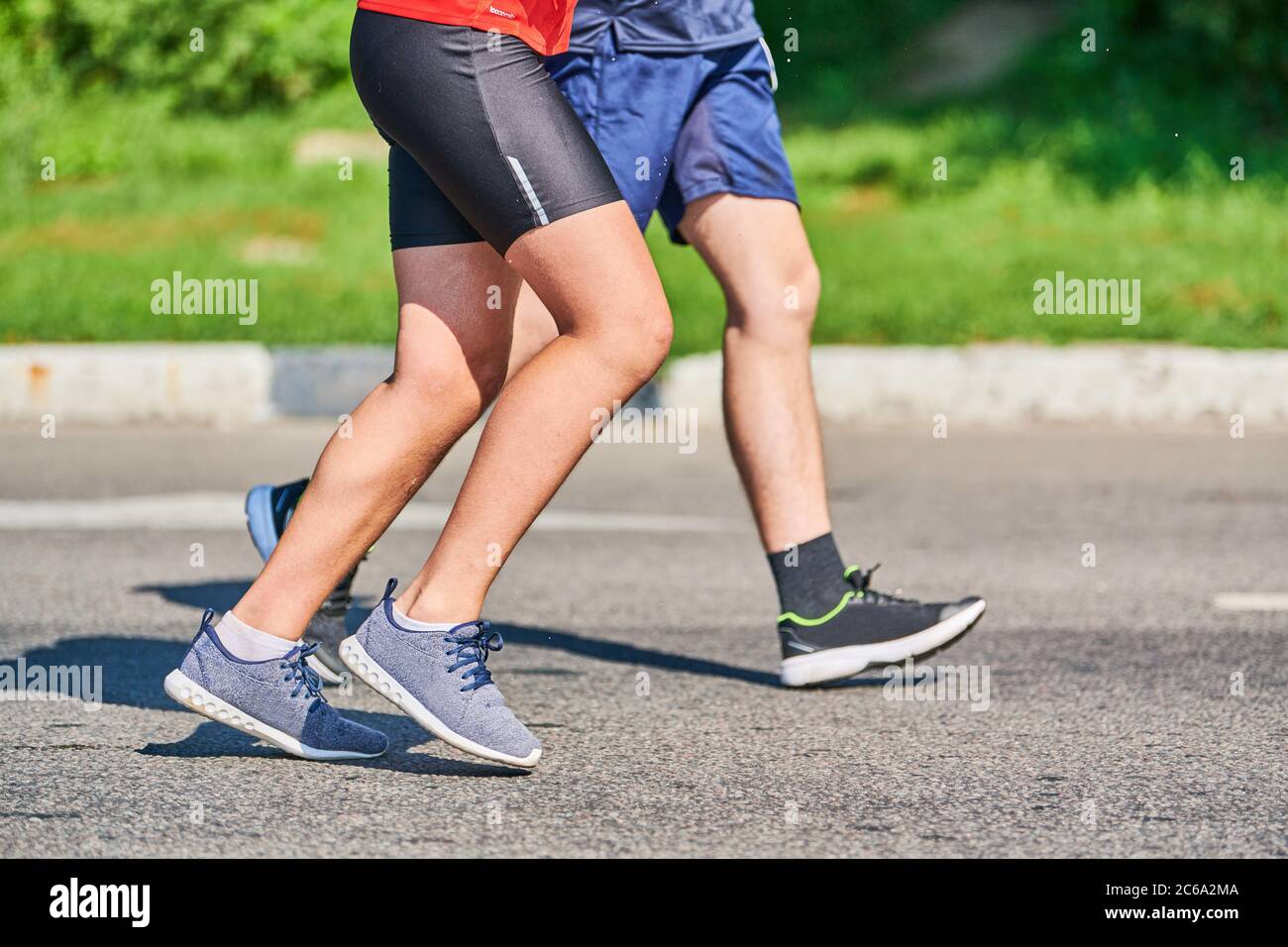 Running men. Sport men jogging in sportswear on city road. Healthy ...