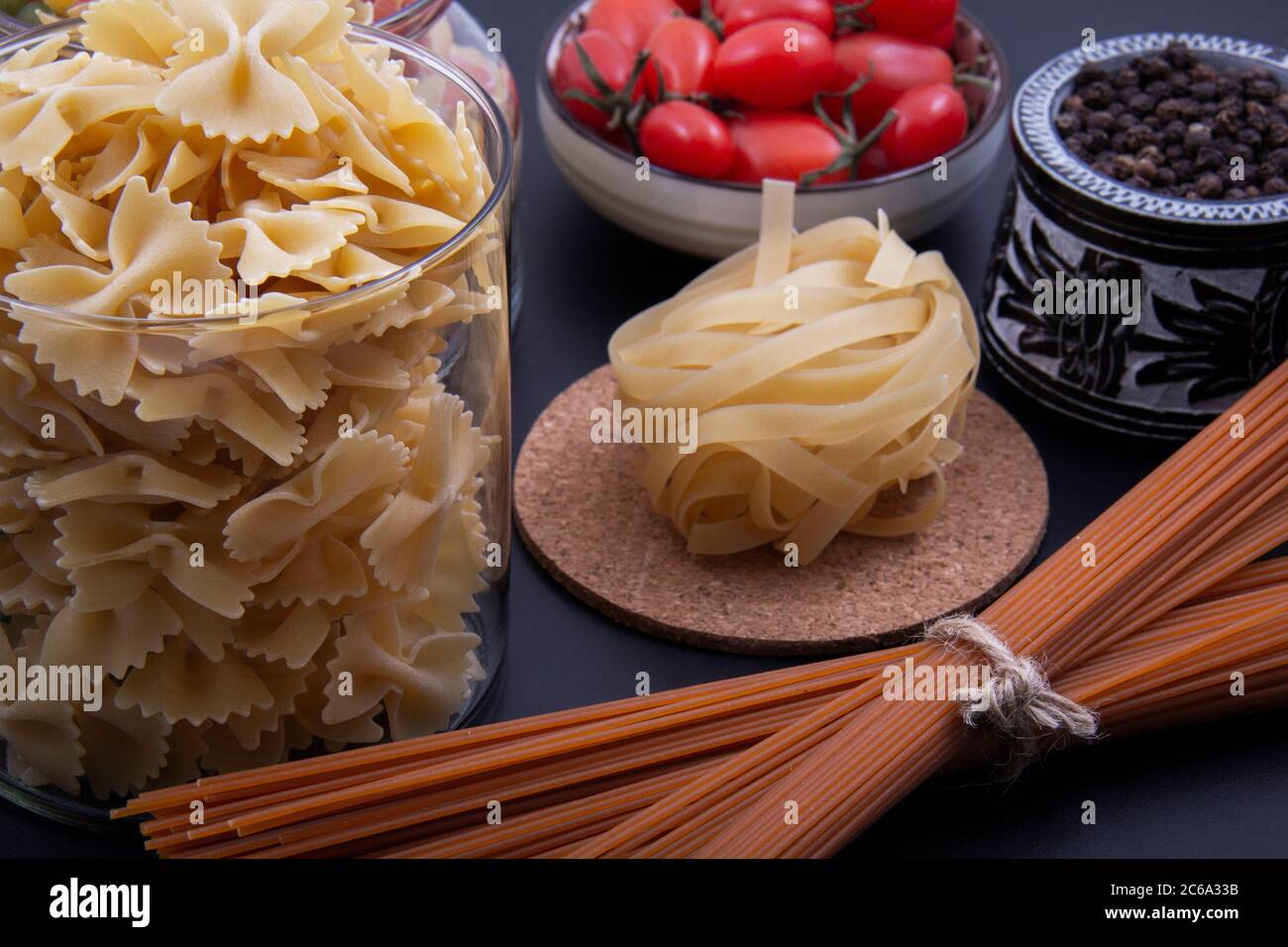 Shaped pasta and plain pasta. Pasta in different shapes and colors with ...