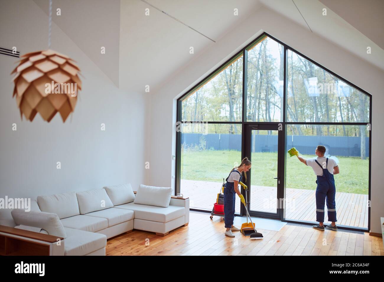 Preparing house for new tenant. Cleaning service washing floor, window ...