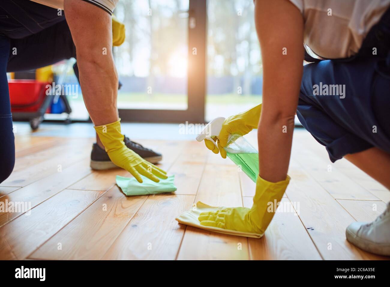 regular clean up. Cleaning people, janitors washing floor with rags and ...