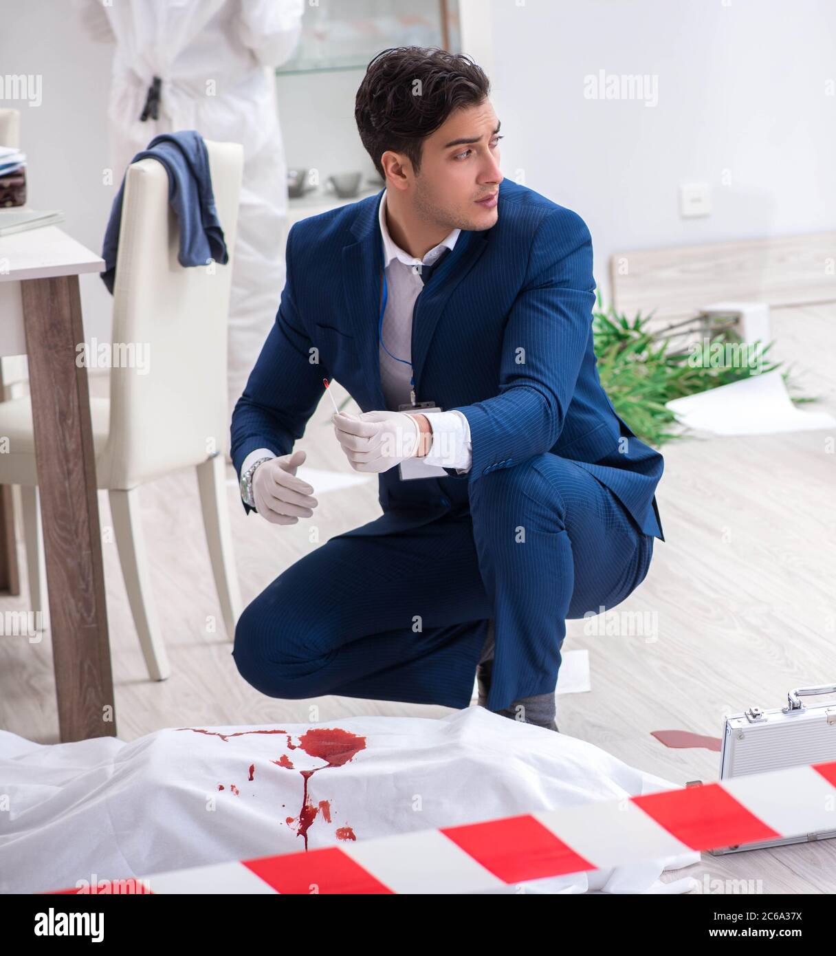 The forensics investigator at the scene of office crime Stock Photo - Alamy