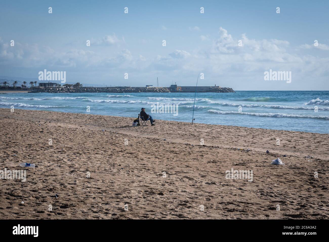 Angler on Ramlet al-Baida public beach situated along the southern end ...