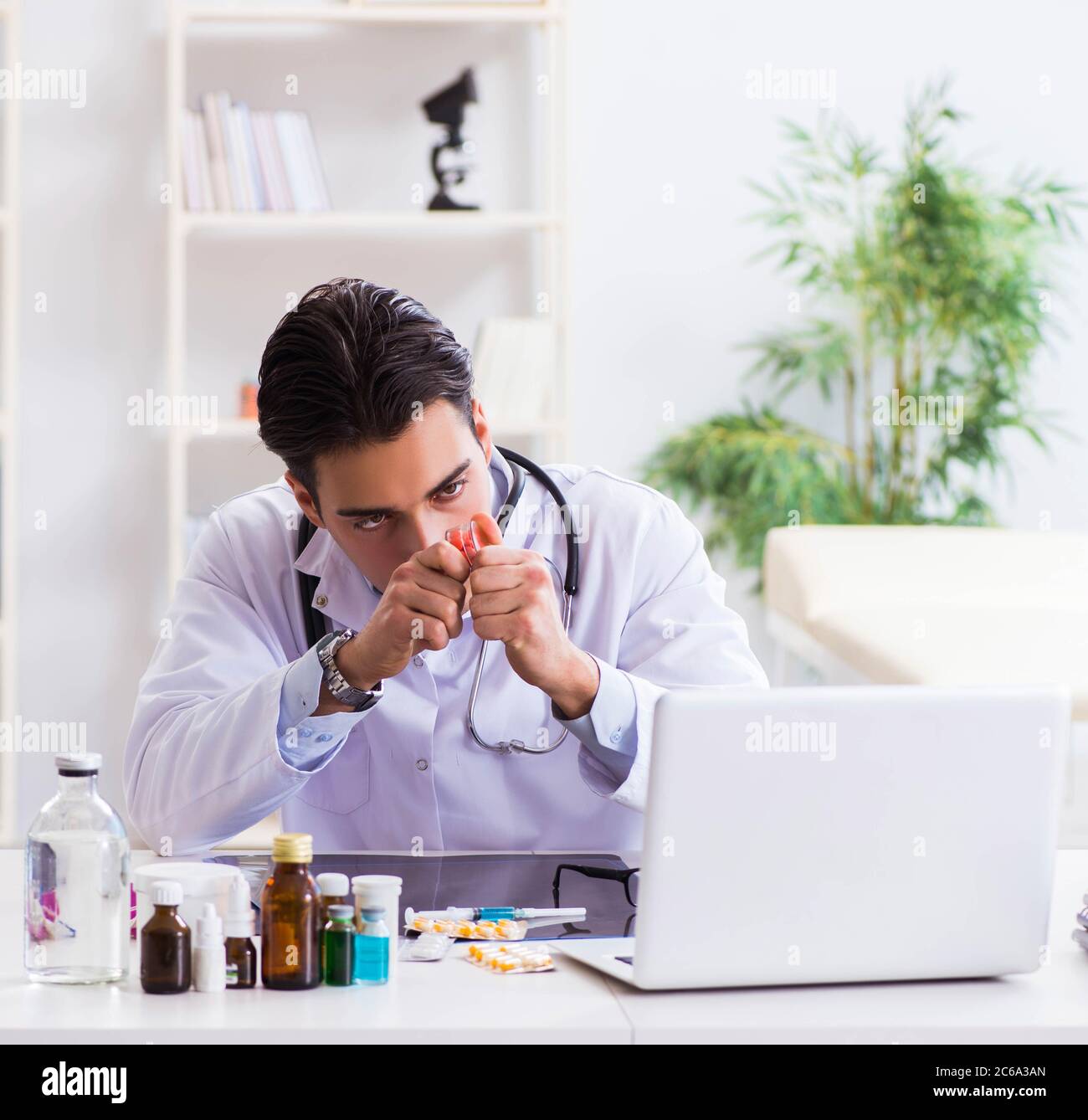 The doctor drug addict in the hospital Stock Photo - Alamy