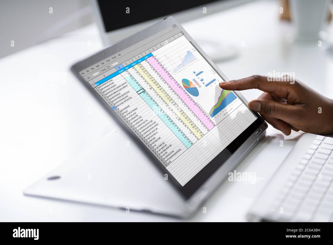 Financial Analyst Using Spreadsheet Software On Laptop Computer Stock ...