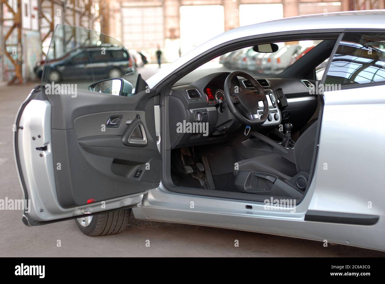 parked sports car on which the door is open Stock Photo - Alamy