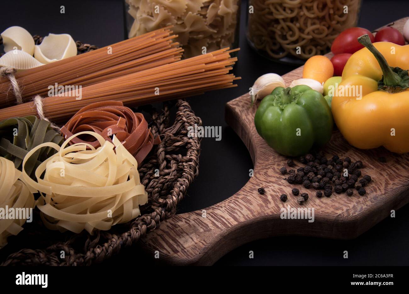 Shaped pasta and plain pasta. Pasta in different shapes and colors with ...