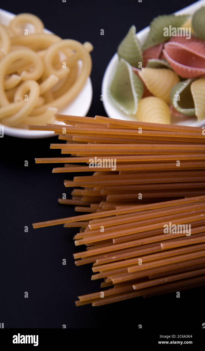 Long brown pasta. Pack of brown pasta with macaroni shape and Colorful ...