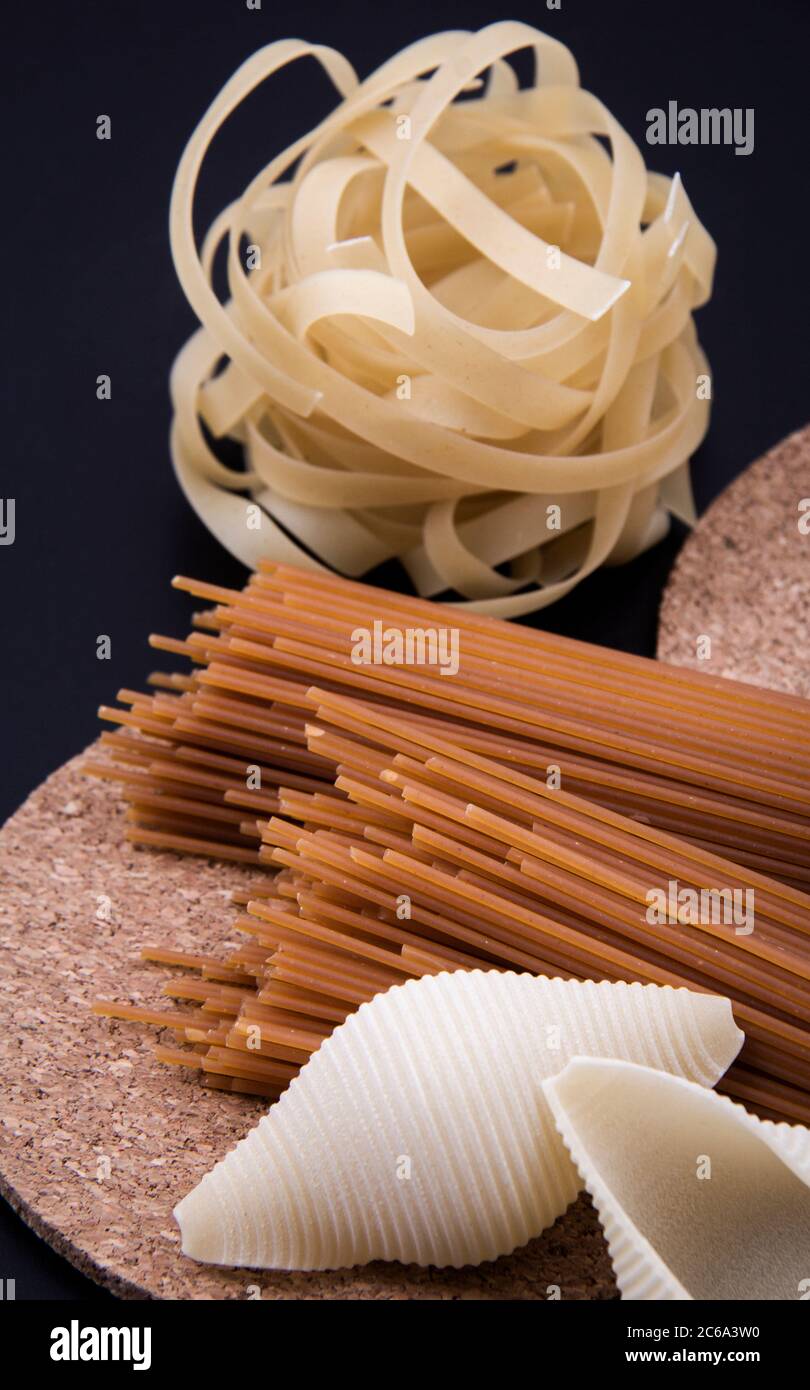 Long brown pasta. Pack of brown pasta with macaroni shape and Colorful ...