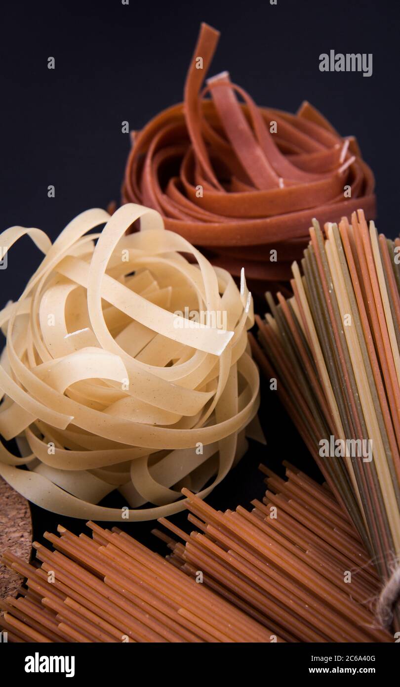 Long brown pasta. Pack of brown pasta with macaroni shape and Colorful ...