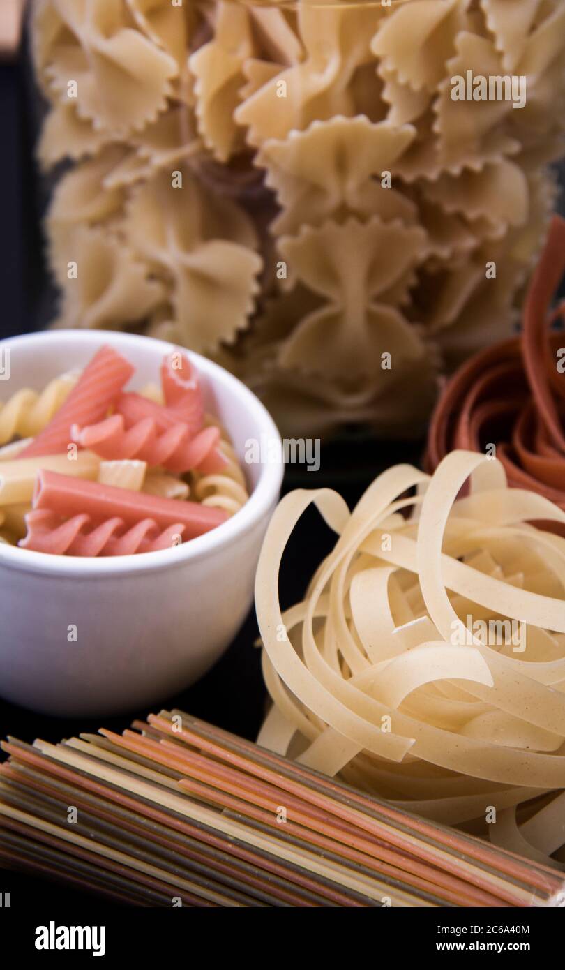 Long brown pasta. Pack of brown pasta with macaroni shape and Colorful ...