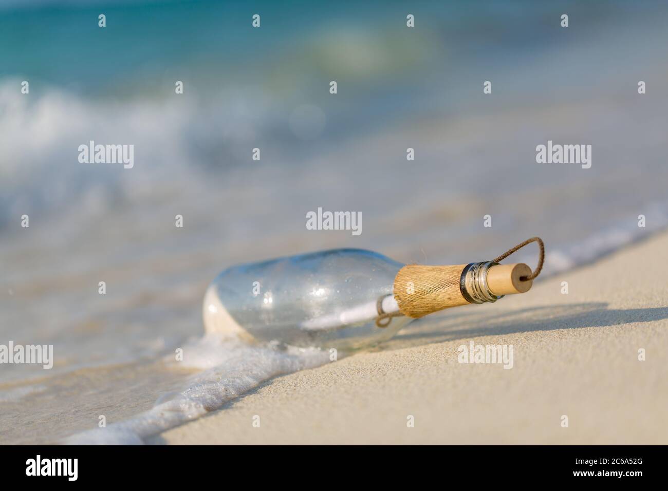 Bottle with a message, sea waves splashing on calm coast, shore. Exotic ...
