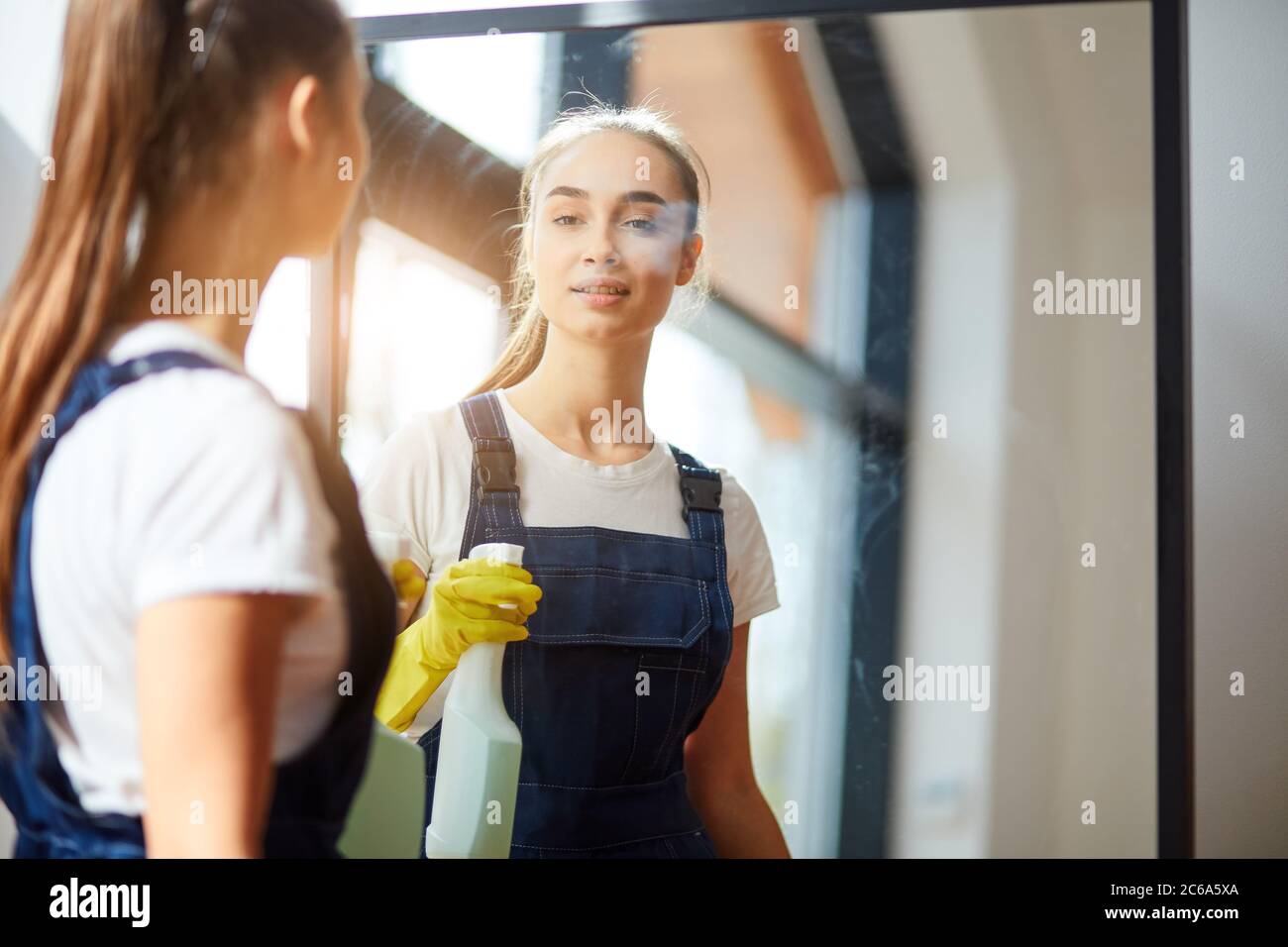Woman wiping mirror housework hi-res stock photography and images - Alamy