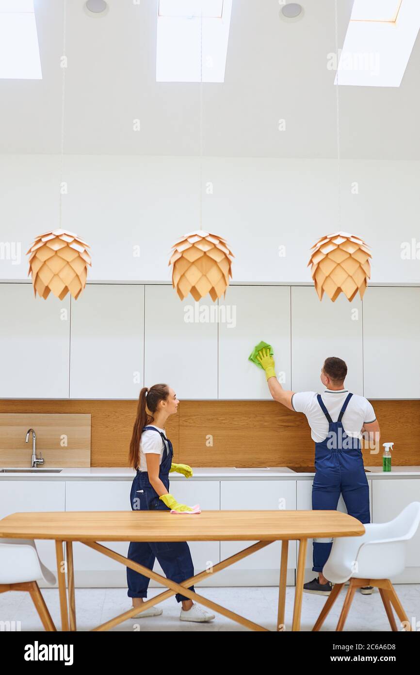 Successful work ot team consisted of two janitors, cleaning kitchen ...