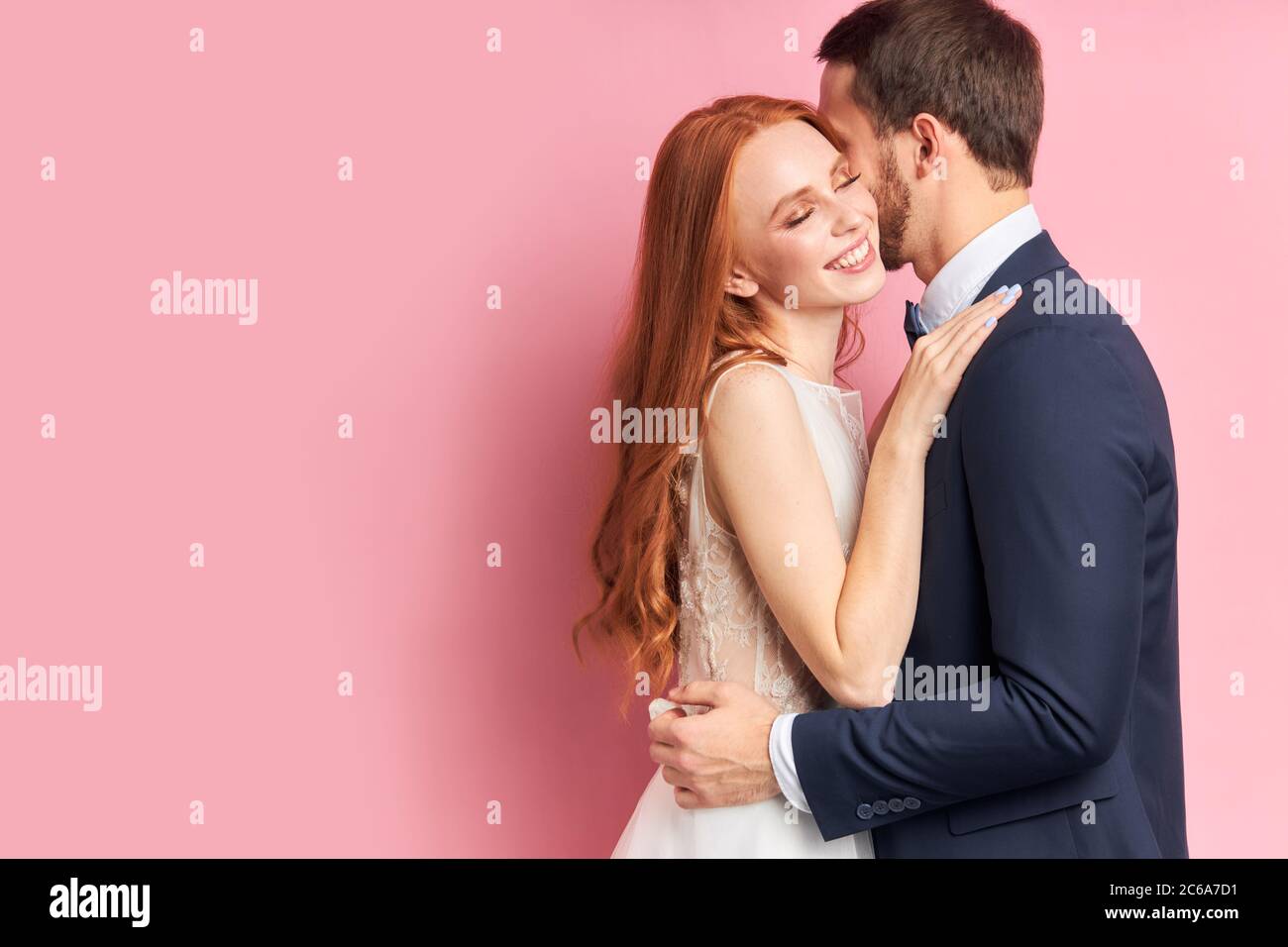 Gorgeous two people get married, woman with red hair, bearded man stand ...