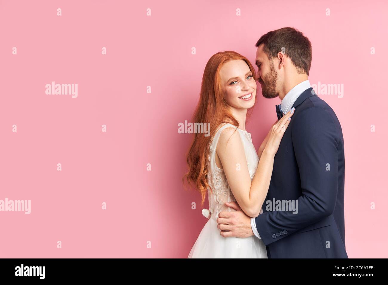 Gorgeous two people get married, woman with red hair, bearded man stand ...