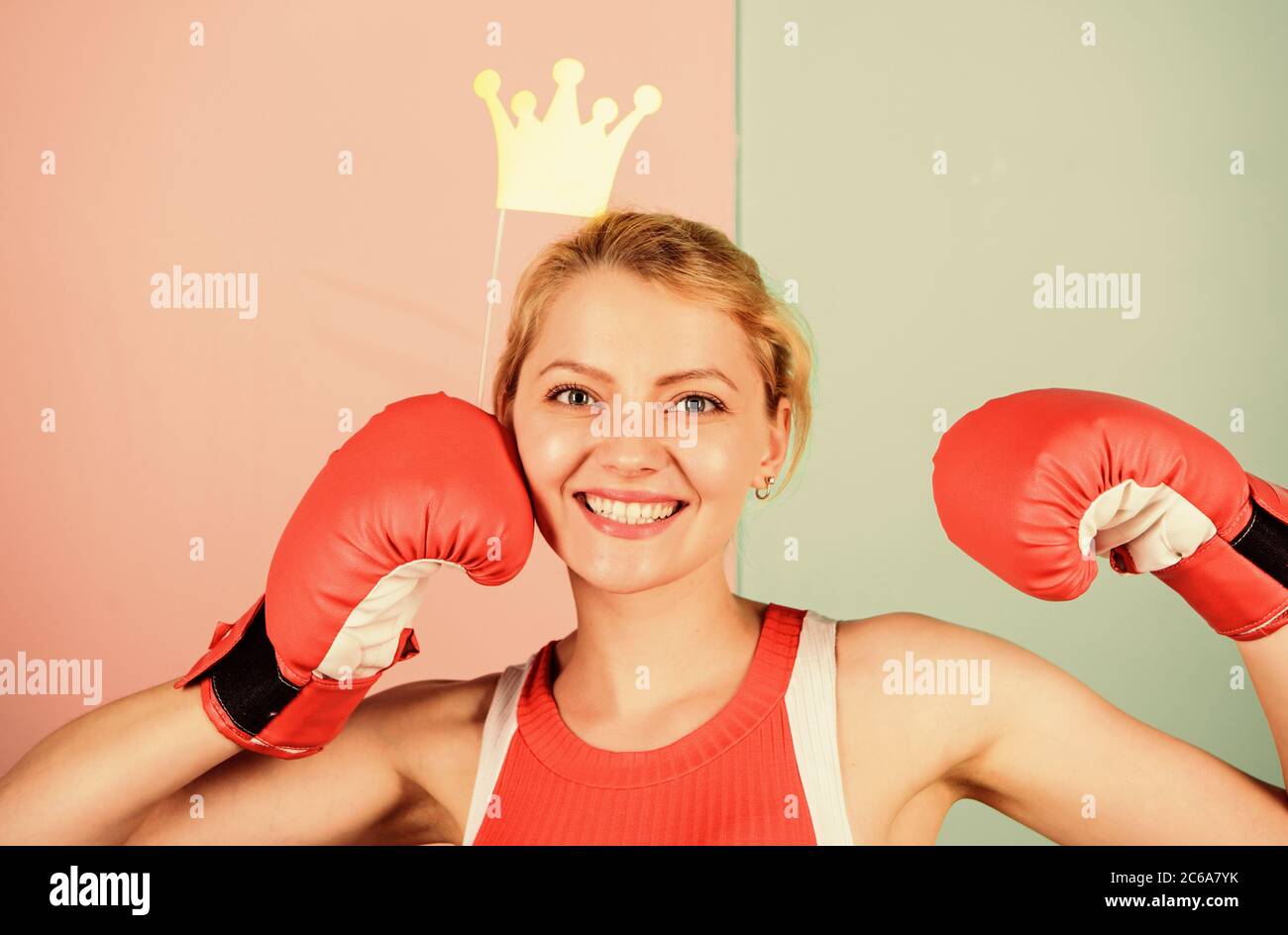 Queen of boxing ring. Sportswoman with princess crown. Cheerful girl ...