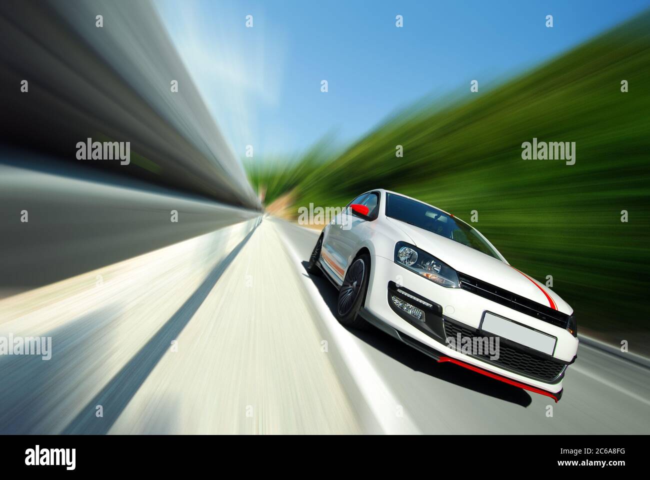Dynamic driving a sports car on the open road Stock Photo - Alamy