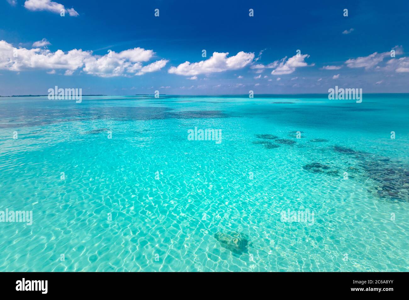 Blue waves lagoon, endless sea ocean water under blue sky with clouds ...
