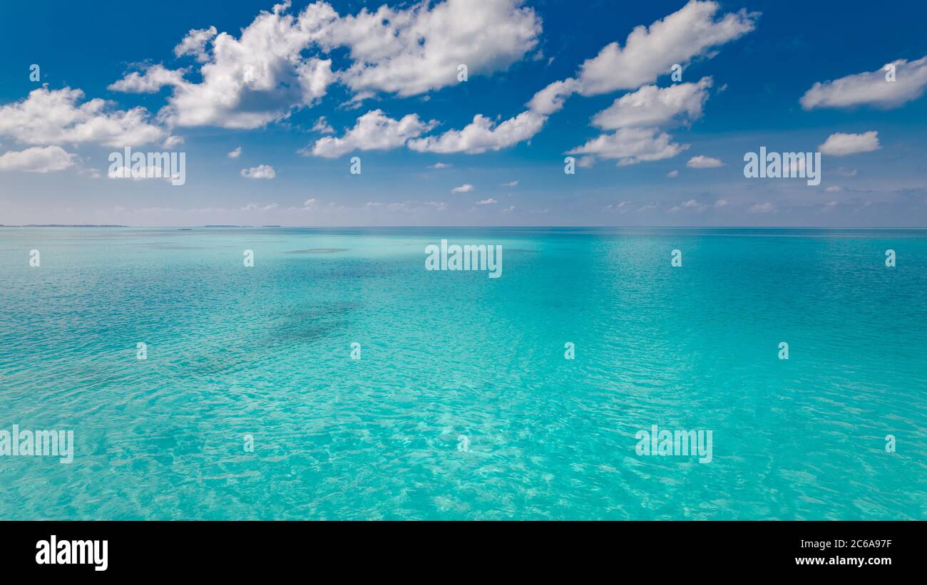 Blue waves lagoon, endless sea ocean water under blue sky with clouds ...
