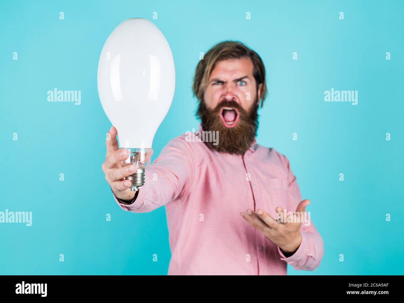 Man smile hold light bulb hi-res stock photography and images - Alamy