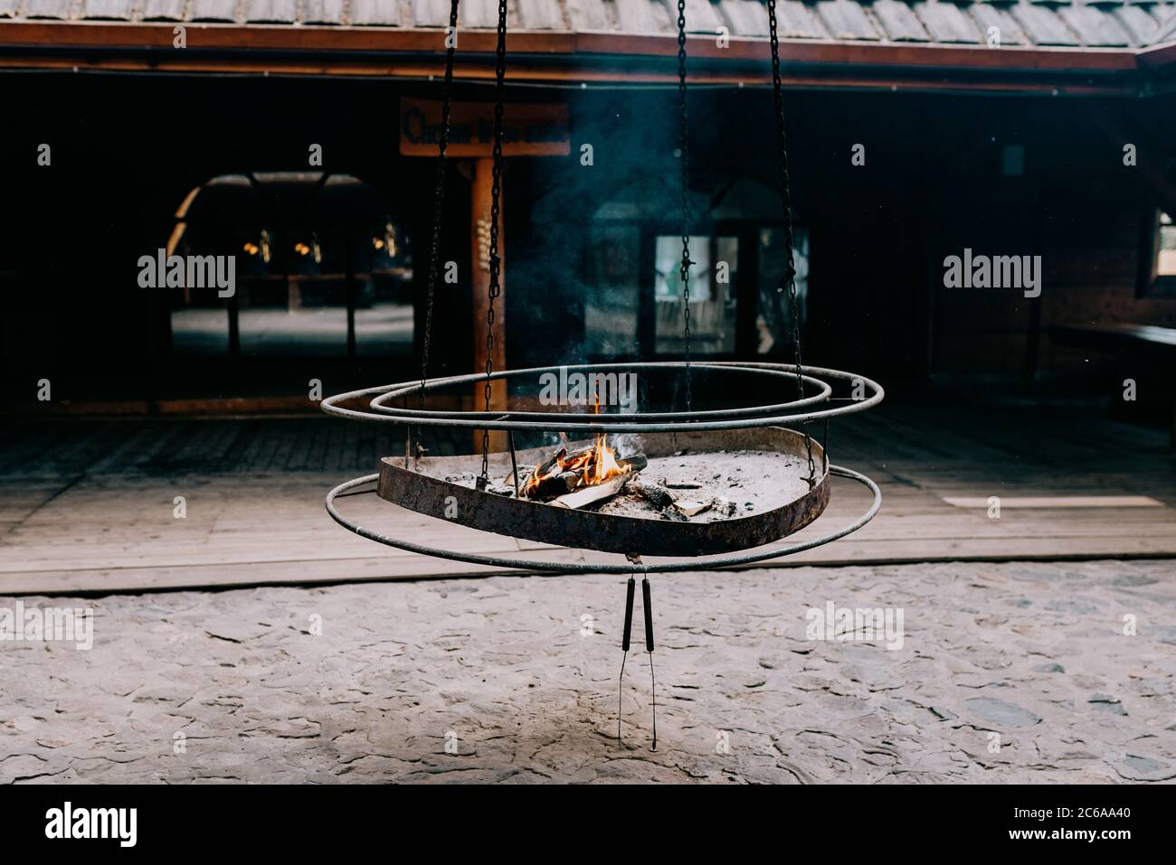 burning bonfire in the hanging hearth Stock Photo - Alamy