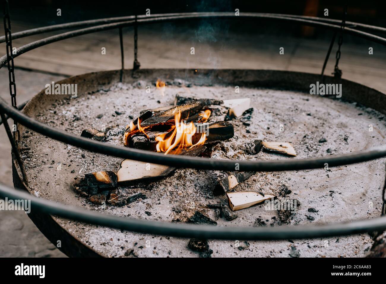 burning bonfire in the hanging hearth Stock Photo - Alamy