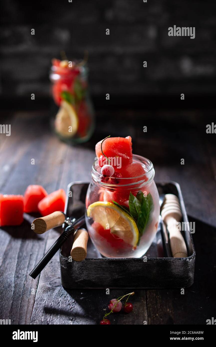 Frozen watermelon cubes in a jar.Fruit drink.A refreshing delicacy.Low ...