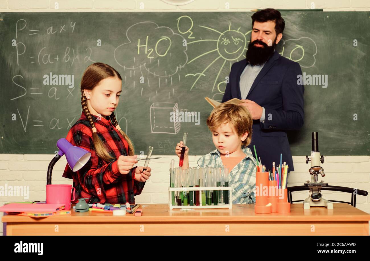happy children teacher. back to school. kids in lab coat learning ...