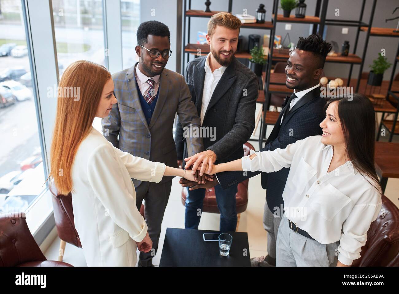 Friendly business colleagues together work as team in office, smile ...