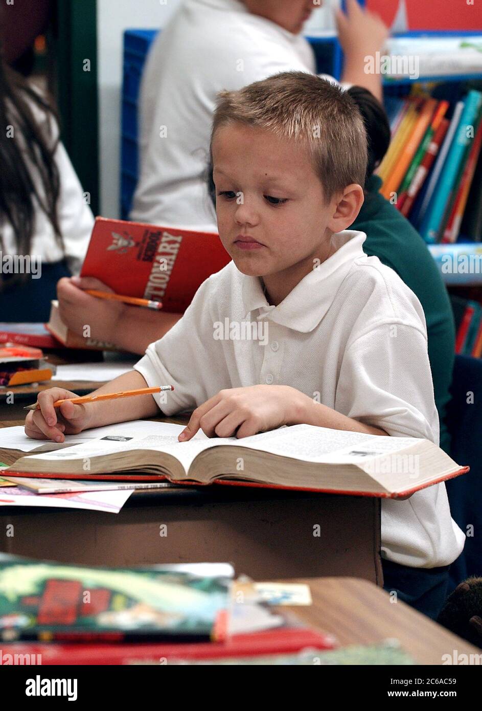 Austin, Texas USA, November 2003: Third grader uses dictionary while ...