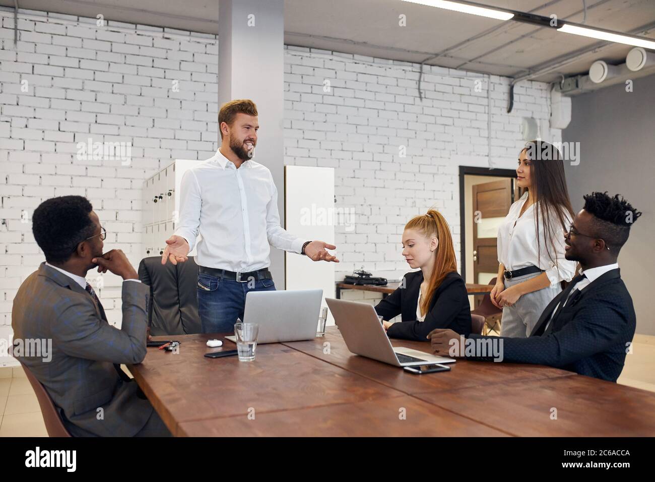Foreign people hold conference at business center in modern office ...