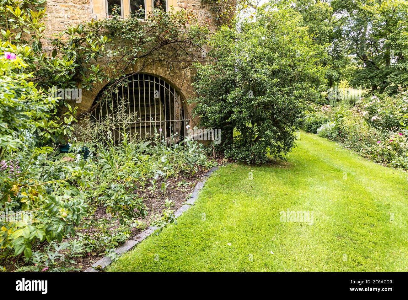 The mill wheel of the Old Mill in the Cotswold village of Upper Swell ...