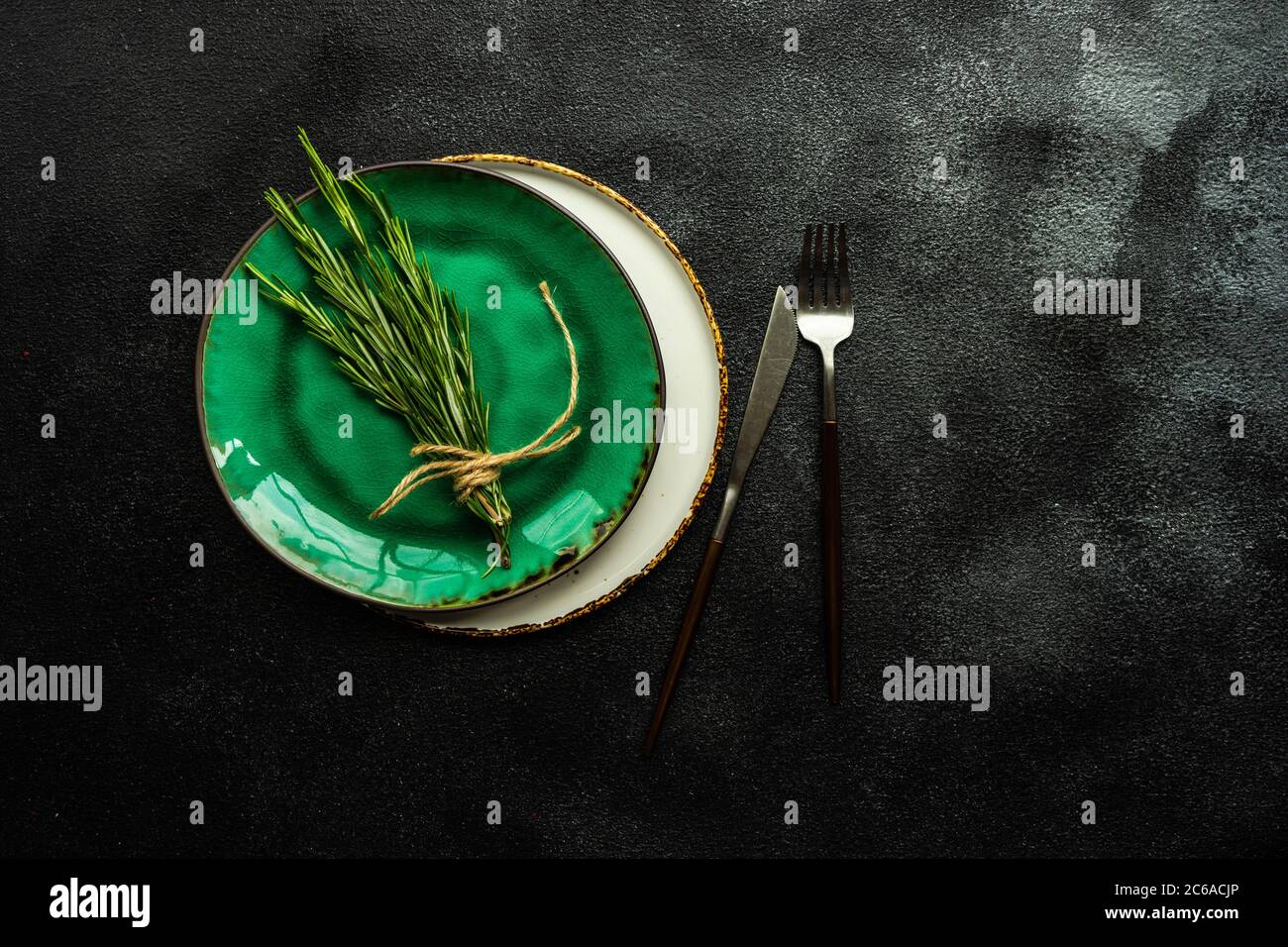 Table setting with rosemary Stock Photo - Alamy