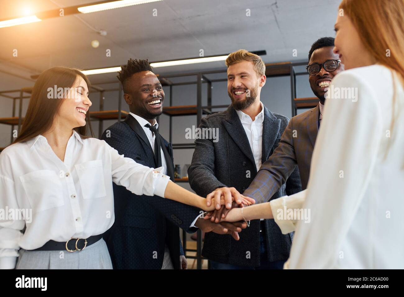 Friendly business colleagues together work as team in office, smile ...