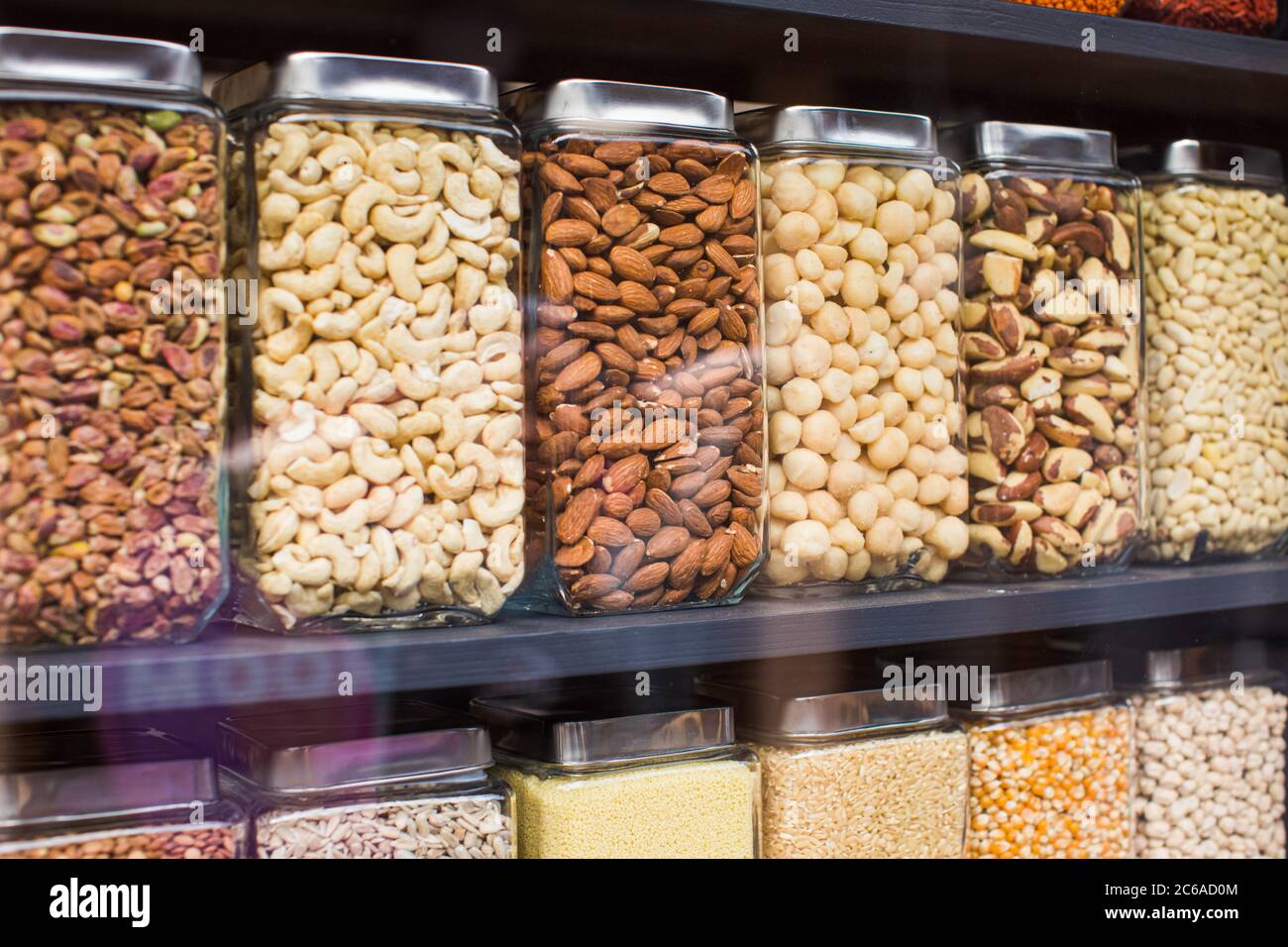 Different types of nuts are packaged in jars for sale Stock Photo - Alamy