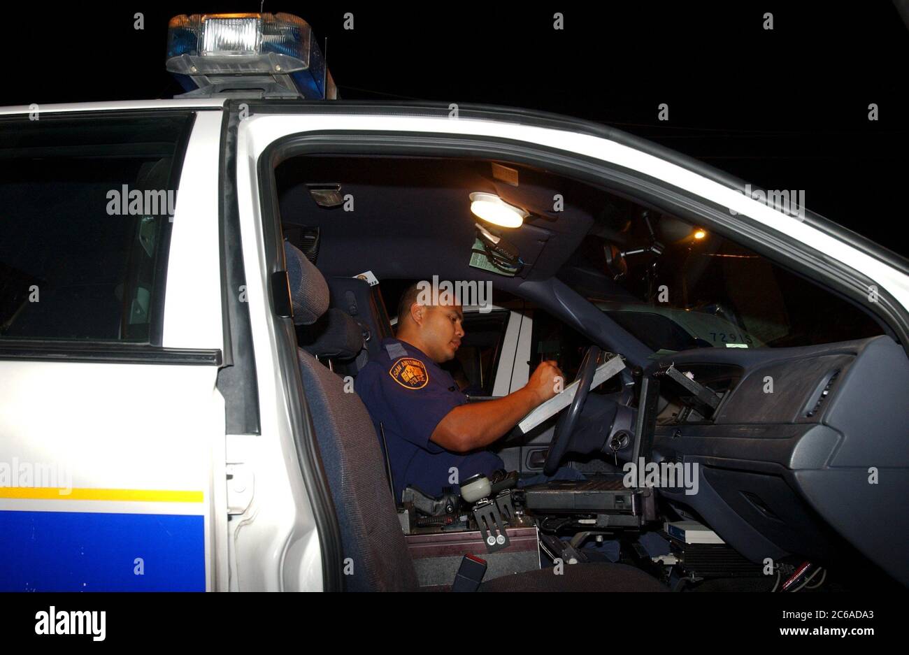 Police officer filling out paperwork hi-res stock photography and ...