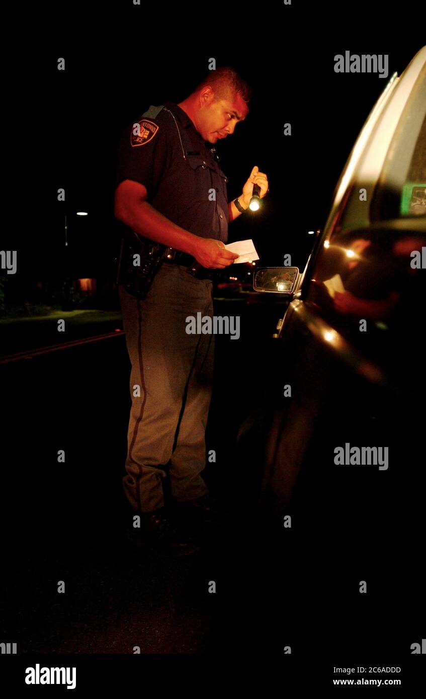 San Antonio, Texas August 7-8, 2003: Hispanic male police officer ...