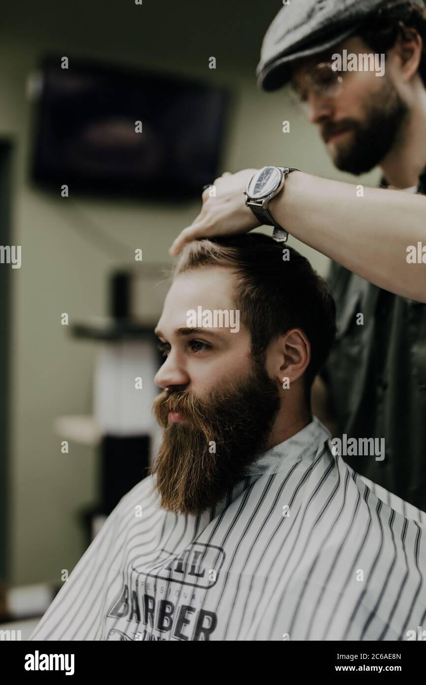 Great time at barbershop. getting haircut by hairdresser and reading ...