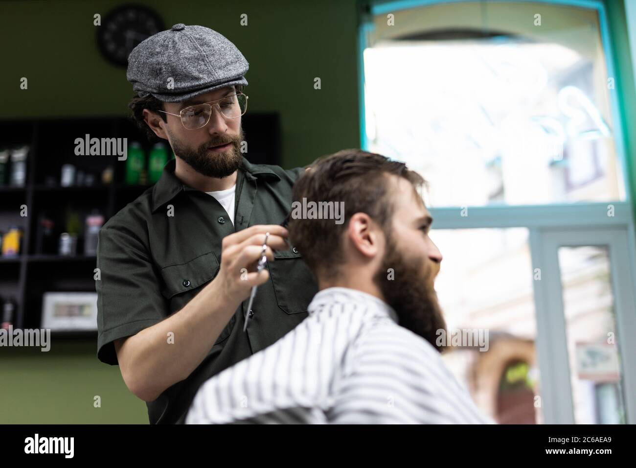 Great time at barbershop. getting haircut by hairdresser and reading ...