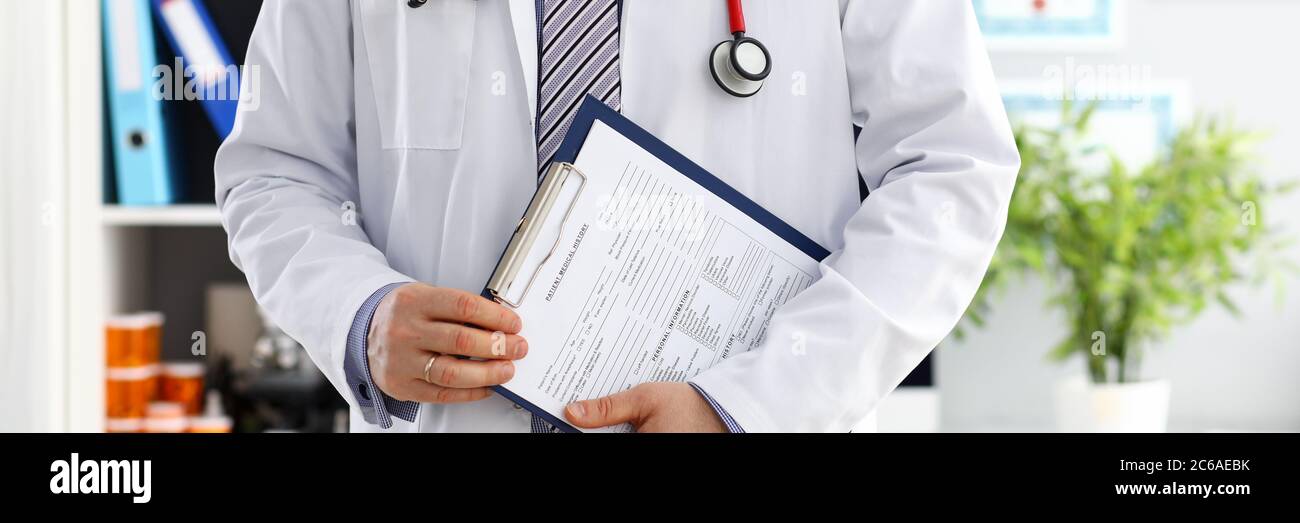 Stethoscope lying on male doctor chest in office Stock Photo - Alamy