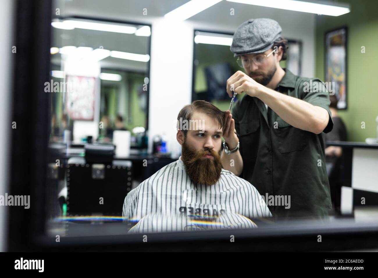 Great time at barbershop. getting haircut by hairdresser and reading ...