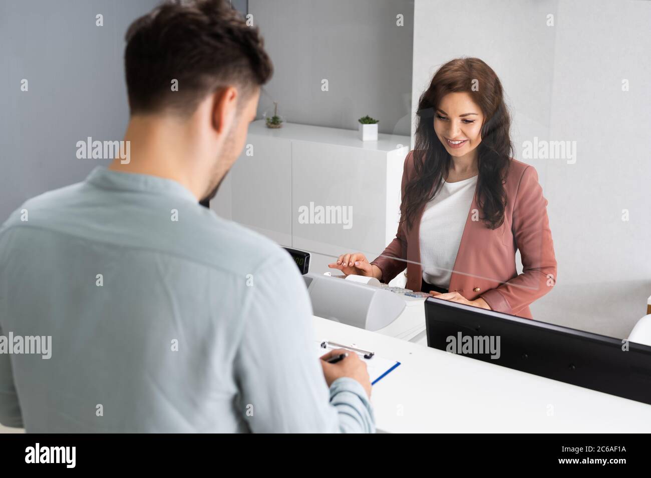 Reception desk man hi-res stock photography and images - Alamy