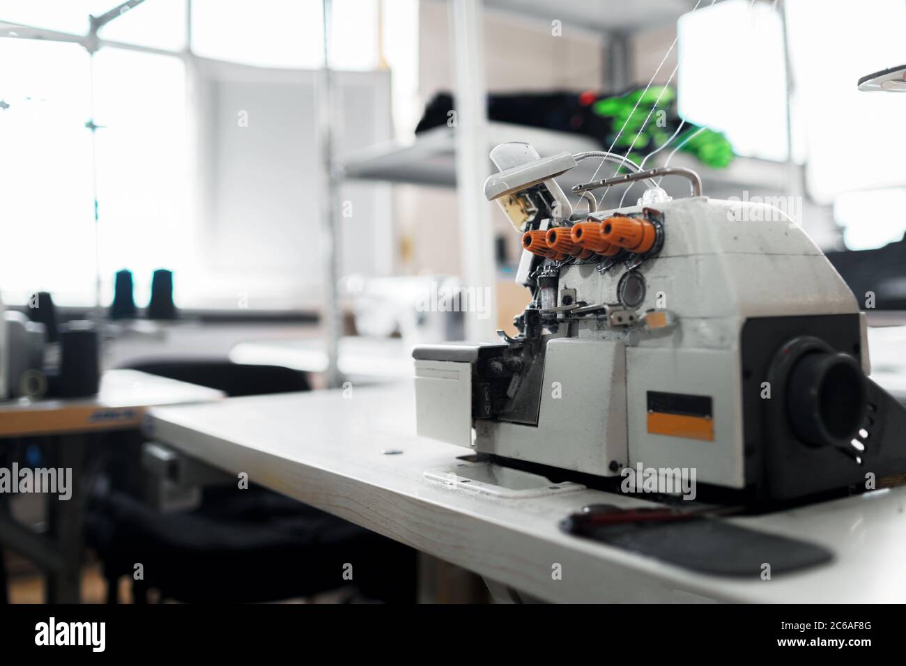 Sewing department of a textile factory interior Stock Photo - Alamy